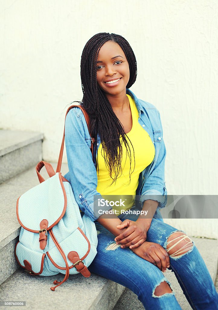 Beautiful Smiling African Woman Wearing Jeans Shirt With Backpack