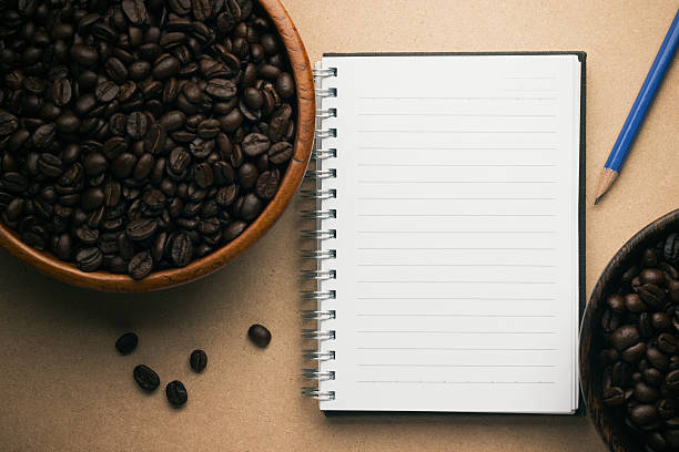 Free Stock Photo of A pile of coffee beans and a spiral notebook ...