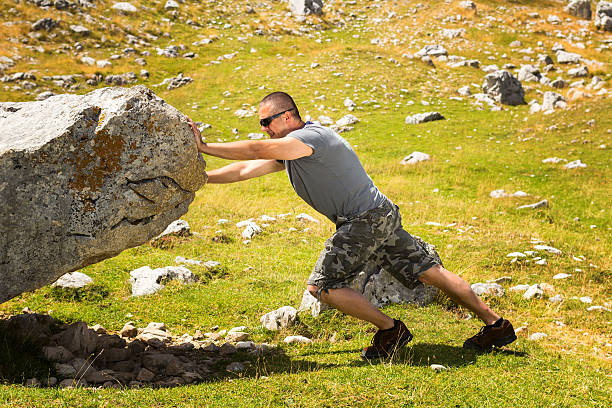 790+ Man Pushing Stone Stock Photos, Pictures & Royalty-Free Images ... 790+ Man Pushing Stone Stock Photos, Pictures & Royalty-Free Images ...