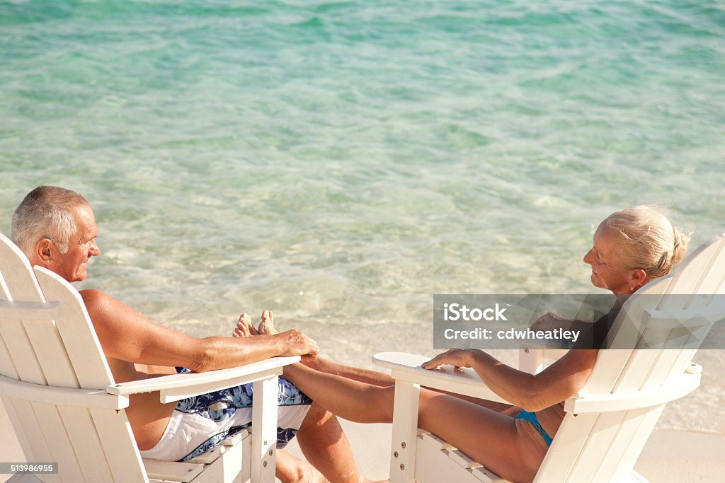 Rear View Of Retired Couple Sunbathing In Beach Chairs Stock Photo ... Rear View Of Retired Couple Sunbathing In Beach Chairs Stock Photo ...