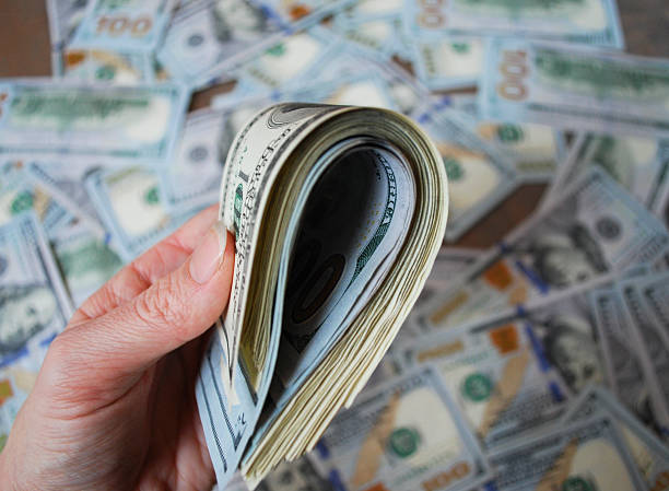 Free Stock Photo of Person holding fanned-out US dollar bills on the ...