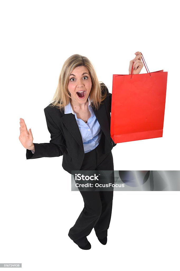 Young Beautiful Woman In Business Suit Holding Red Shopping Bag Stock