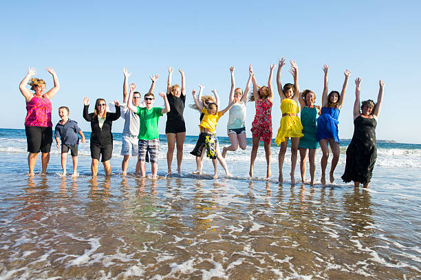 Free Stock Photo of Group of People Standing on Top of a Beach by the ...