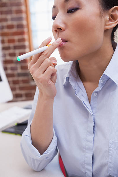 Free Stock Photo of Woman Smoking Cigarette at Desk | Download Free ...