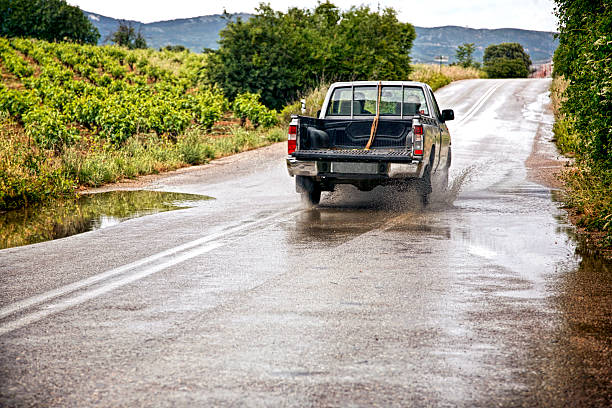 Free Stock Photo of White Truck Driving Down Wet Road | Download Free ...