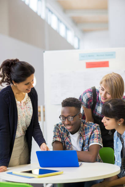 Free Stock Photo of A group of multiethnic students working on project ...