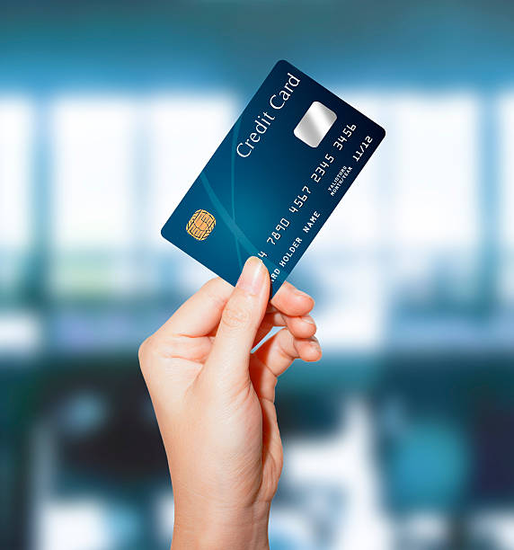 Free Stock Photo of Blurred credit card in hand emphasis on card ...