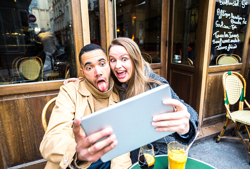 Friends Making Funny Faces And Taking Selfie With Digital Tablet Stock
