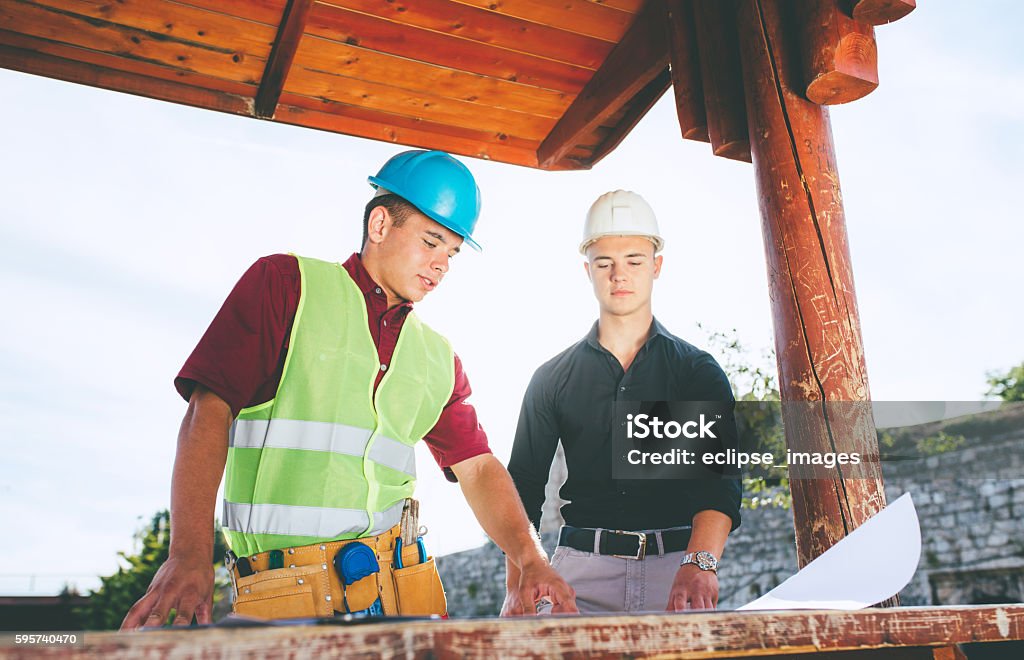 Construction Workers Reviewing Plans Stock Photo - Download Image Now ... Construction Workers Reviewing Plans Stock Photo - Download Image Now ...