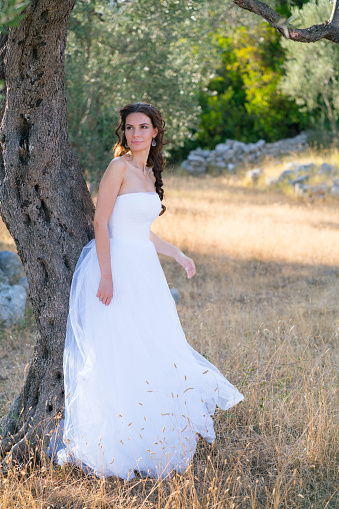 Attractive Young Woman Enjoying Her Time Outside In Olive Trees Stock
