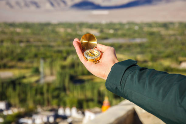 Free Stock Photo of Person Holding Compass on Mountain Top | Download ...