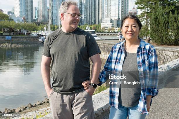 Happy Canadian Couple Spends Time Walking Outdoors In Downtown ... Happy Canadian Couple Spends Time Walking Outdoors In Downtown ...