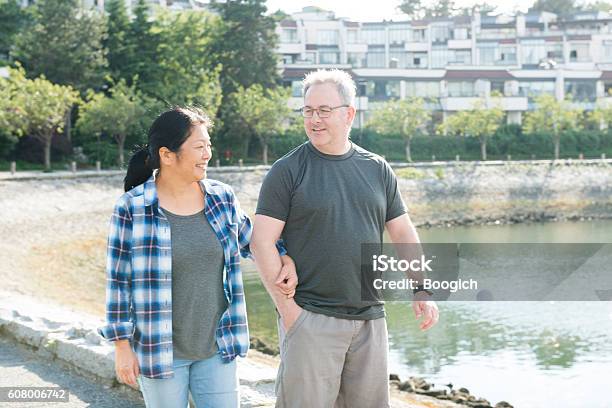 Happy Canadian Couple Spends Time Walking Outdoors In Downtown ... Happy Canadian Couple Spends Time Walking Outdoors In Downtown ...