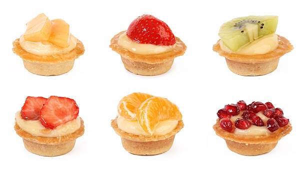 Free Stock Photo of Assorted mini fruit tarts arranged on white ...