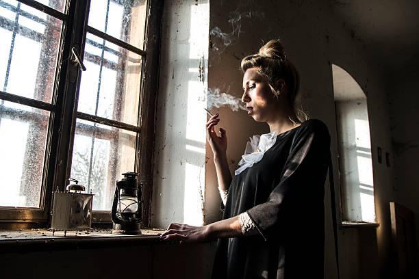 Free Stock Photo of Woman Smoking a Cigarette in Front of a Window ...