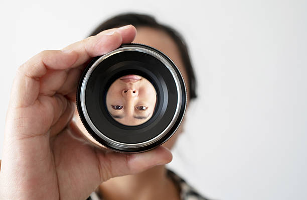 Free Stock Photo of Hand Holding Camera Lens in Front of Mirror ...