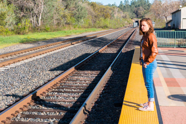 Free Stock Photo of Person Standing on Ledge Next to Train Track ...