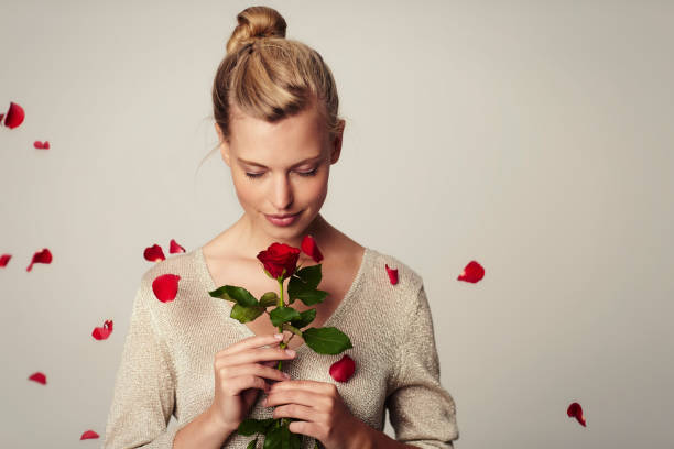 Free picture: A woman holding pinkish rose flowers on her face an ...