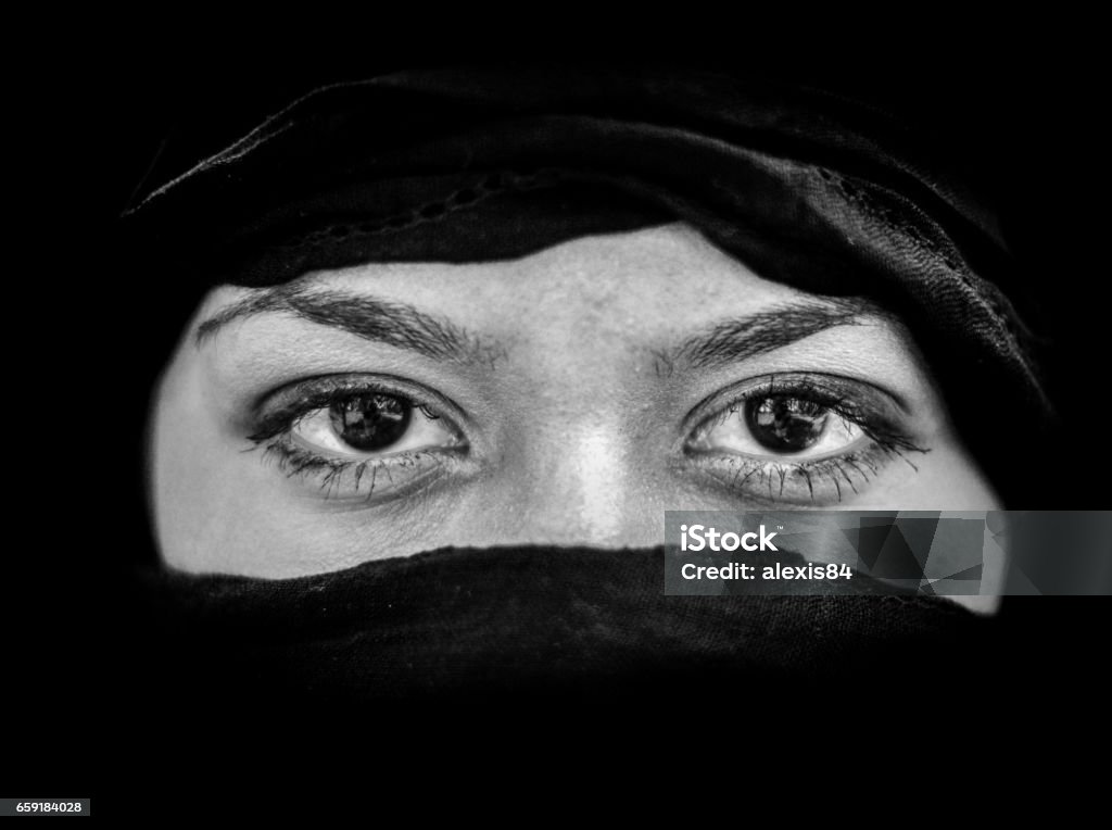 Portrait Of Beautiful Arab Woman Wearing Black Scarf In Black And White