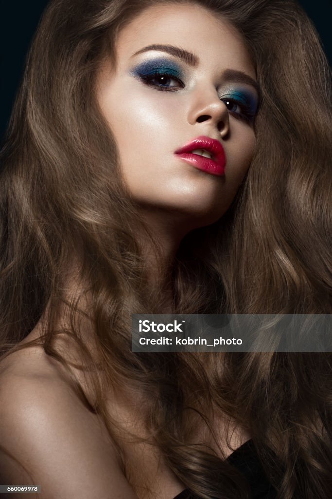 Beautiful Girl In Hollywood Manner With Curls Red Lips And Blue Makeup