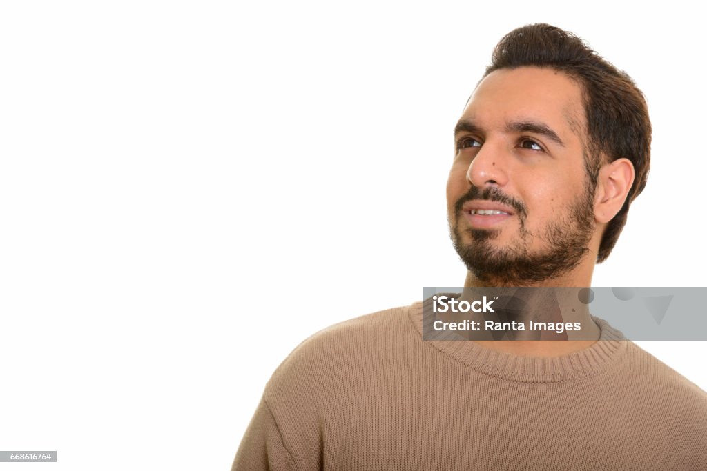 Close Up Of Young Happy Indian Man Smiling While Thinking And Looking