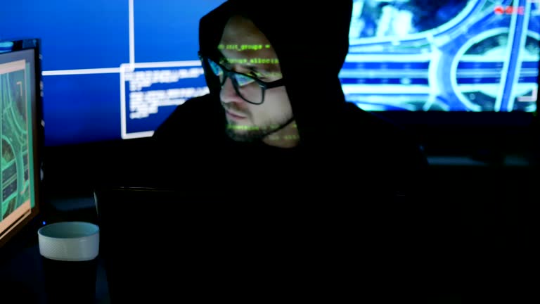 It Professional Programmer In Glasses Is Working On Computer In Cyber Security Center Filled