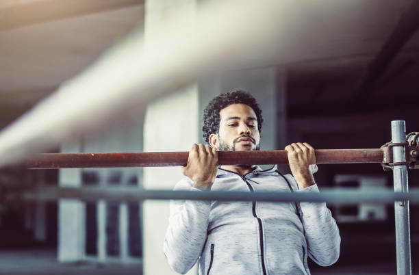 Free Stock Photo of A young african man doing chin-up exercise ...