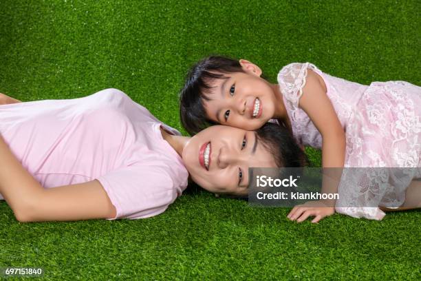 Asian Chinese Mother And Daughter Looking At Camera And Smiling Stock
