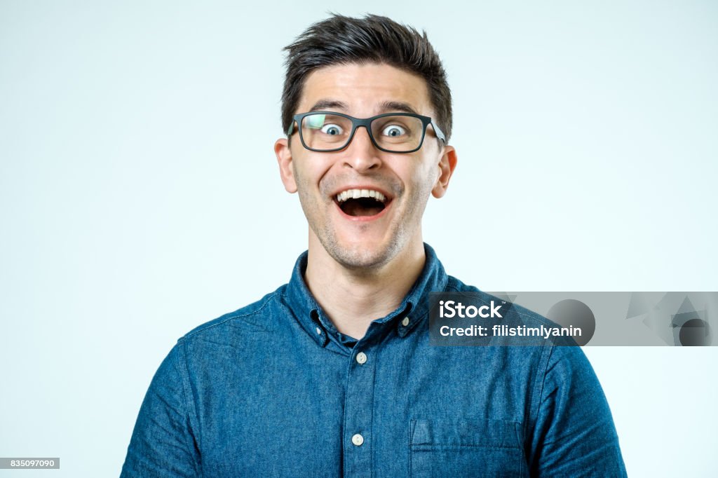 Man With Shocked Amazed Expression Isolated On Gray Background Stock