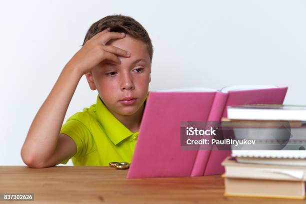 Pensive Tween Boy Reading Book At Home Stock Photo - Download Image Now ... Pensive Tween Boy Reading Book At Home Stock Photo - Download Image Now ...