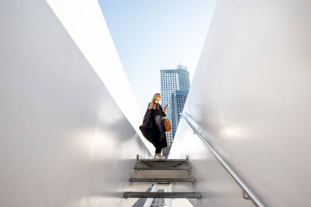 Free Stock Photo of Woman Standing on Staircase Looking Up at Sky ...