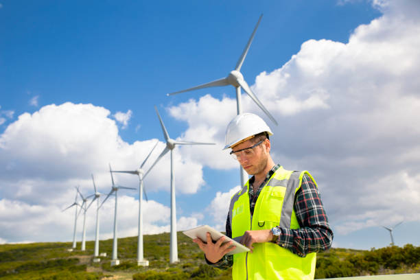 Free Stock Photo of Engineer working on wind turbine and solar cell ...
