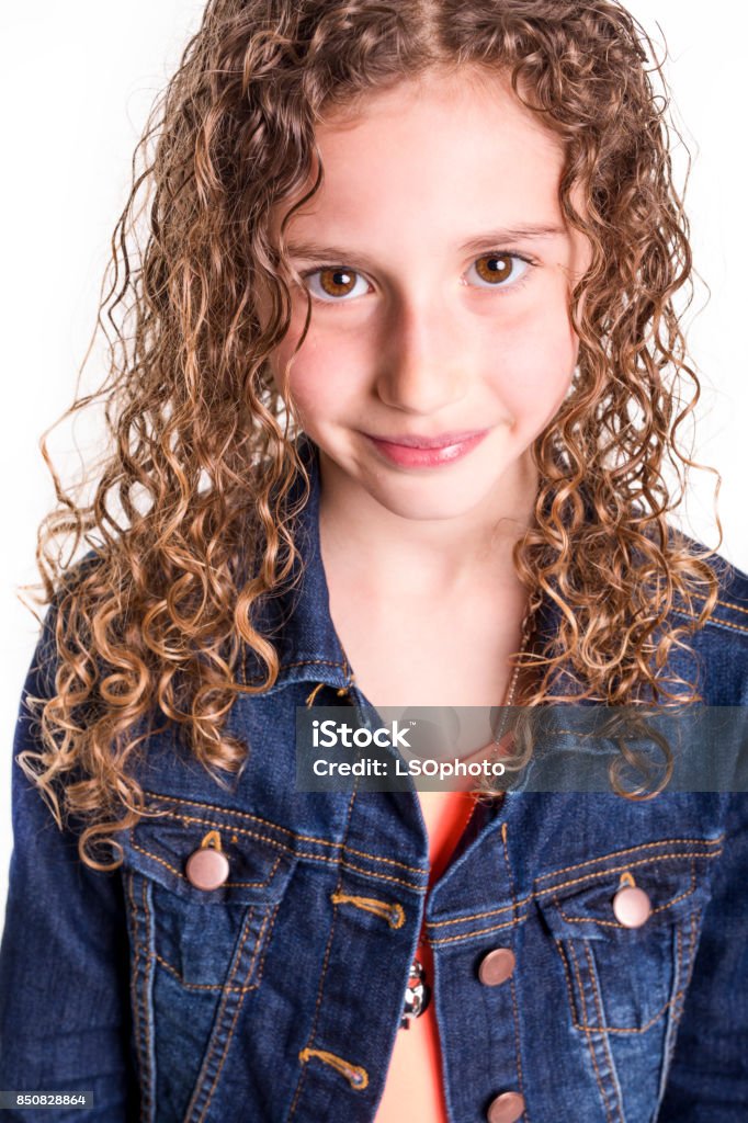 Portrait Of Happy Smiling Confident 9 Years Old Girl With Curly Hair