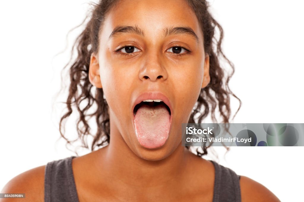 Beautiful Dark Skinned Girl With Open Mouth And Tongue Out On White