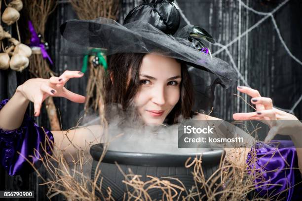 A Brunette With Brown Eyes In The Image Of A Witch Above A Cauldron