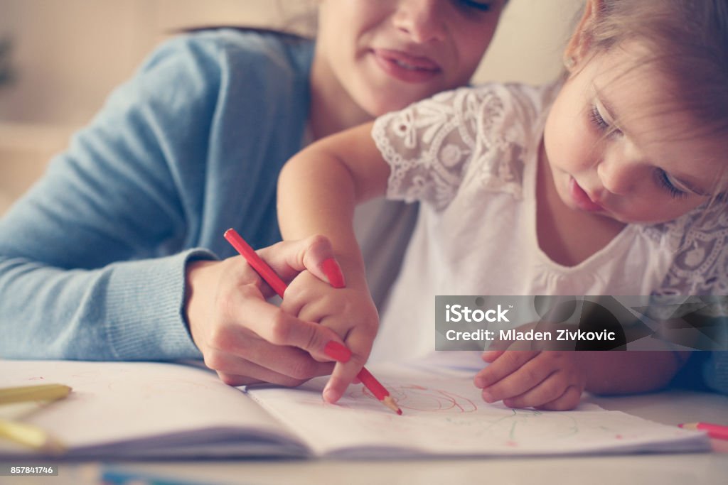 Mother And Daughter At Home Mother Teaching Her Daughter To Drawing And ... Mother And Daughter At Home Mother Teaching Her Daughter To Drawing And ...