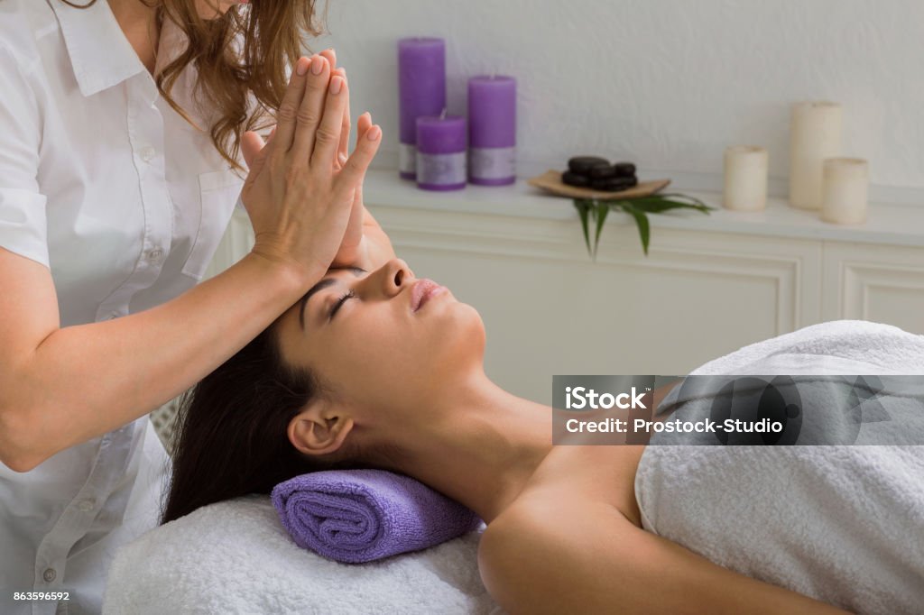 Woman Beautician Doctor Make Head Massage In Spa Wellness Center Stock