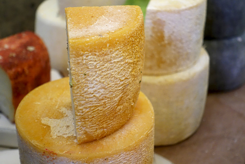 Whole And Notched Heads Of Different Kinds Of Cheese Stock Photo ... Whole And Notched Heads Of Different Kinds Of Cheese Stock Photo ...