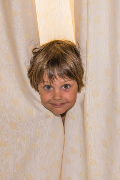 170+ Person Peaking Behind Curtain Stock Photos, Pictures & Royalty ... 170+ Person Peaking Behind Curtain Stock Photos, Pictures & Royalty ...