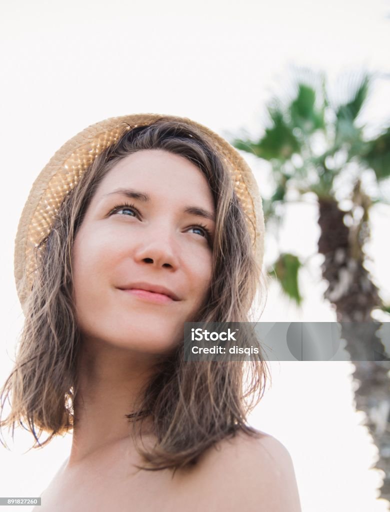 Beautiful Young Woman Summer Portrait On Beach Wearing Straw Hat Stock