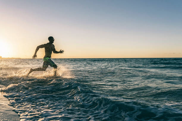 Free Stock Photo of Man running into the sea with a surfboard ...