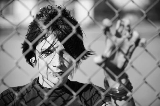 Free Stock Photo of Woman behind chain link fence looking at camera ...