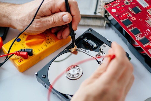 Technician Repairing Broken Hard Disk Drive Stock Photo - Download ... Technician Repairing Broken Hard Disk Drive Stock Photo - Download ...