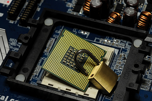 Cpu Computer Processor Over Motherboard And Padlock Security Concept