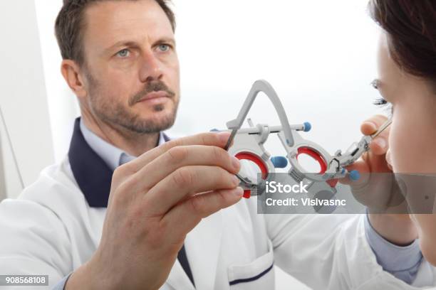 Optician Hands With Trial Frame Optometrist Doctor Examines Eyesight ... Optician Hands With Trial Frame Optometrist Doctor Examines Eyesight ...