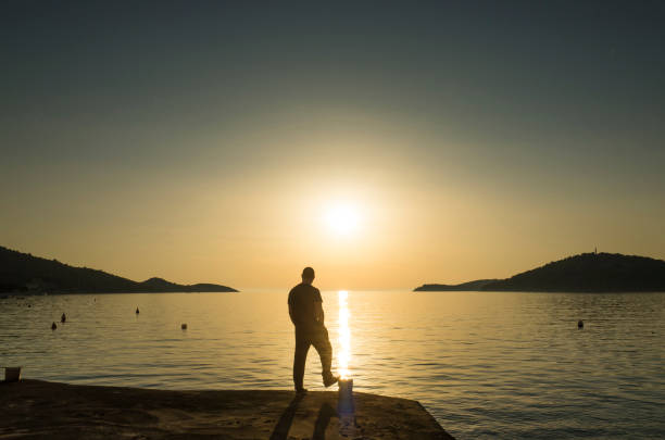 Free picture: Man standing on a water with beautiful sunset in the ...