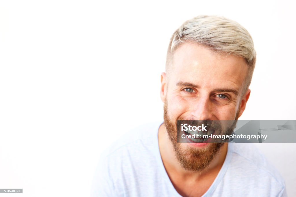 Close Up Young Man With Beard Laughing Against White Background Stock