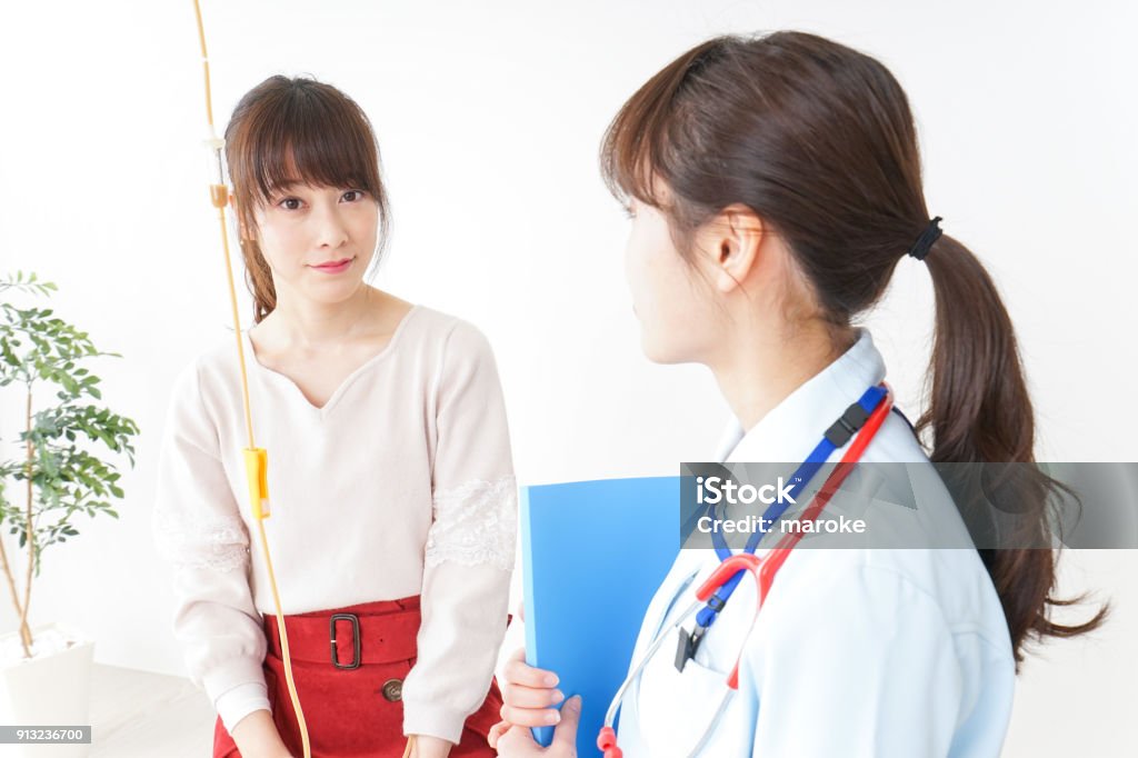 Woman Inserting An Intravenous Line Stock Photo - Download Image Now ... Woman Inserting An Intravenous Line Stock Photo - Download Image Now ...
