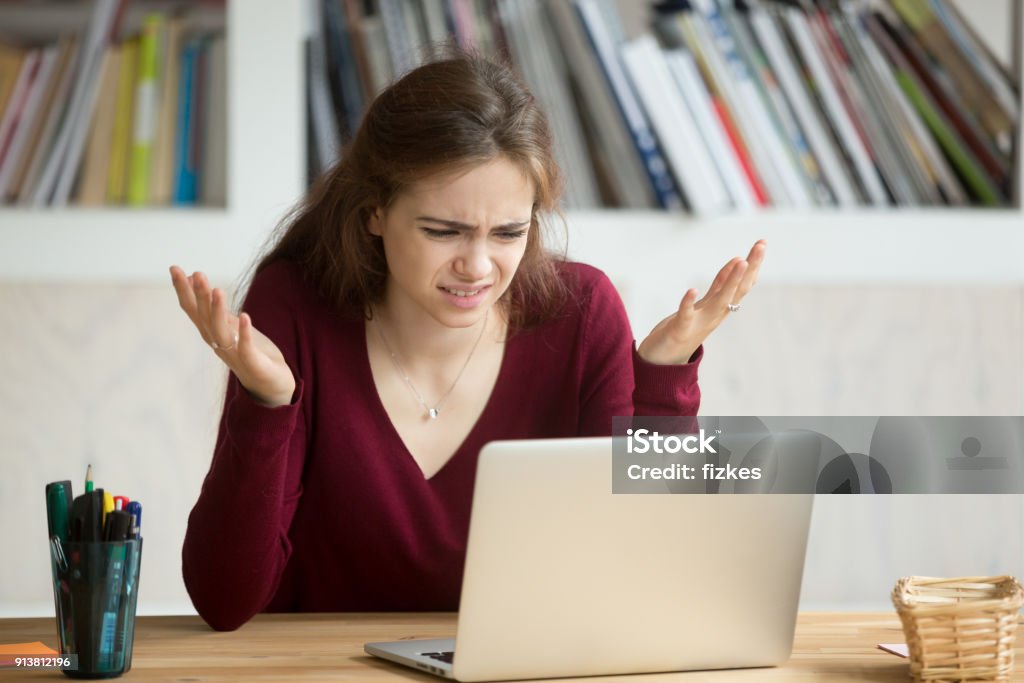 Frustrated Annoyed Woman Confused By Computer Problem Looking At Laptop