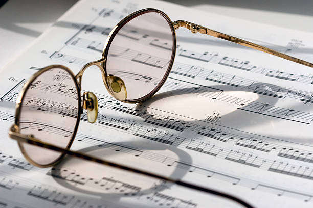 Free Stock Photo of Eyeglasses on a musical score sheet | Download Free ...
